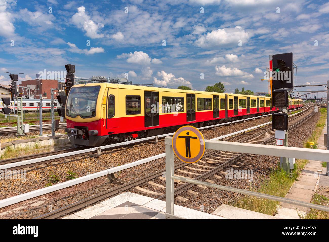View of Berlin U-Bahn above ground station with yellow subway cars ...