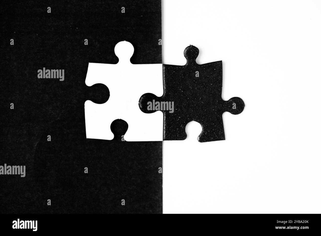 Opposite day concept using white and black puzzle pieces with oposite ...