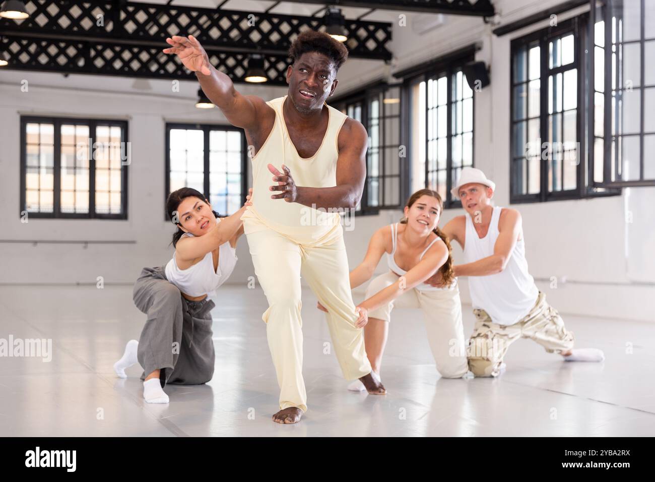 Group of artists rehearsing spectacle scene Stock Photo - Alamy