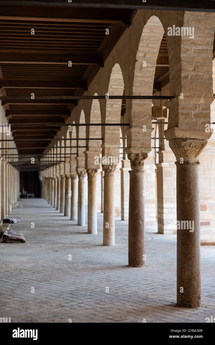 Riwaq with arches and columns around courtyard of Great Mosque of ...