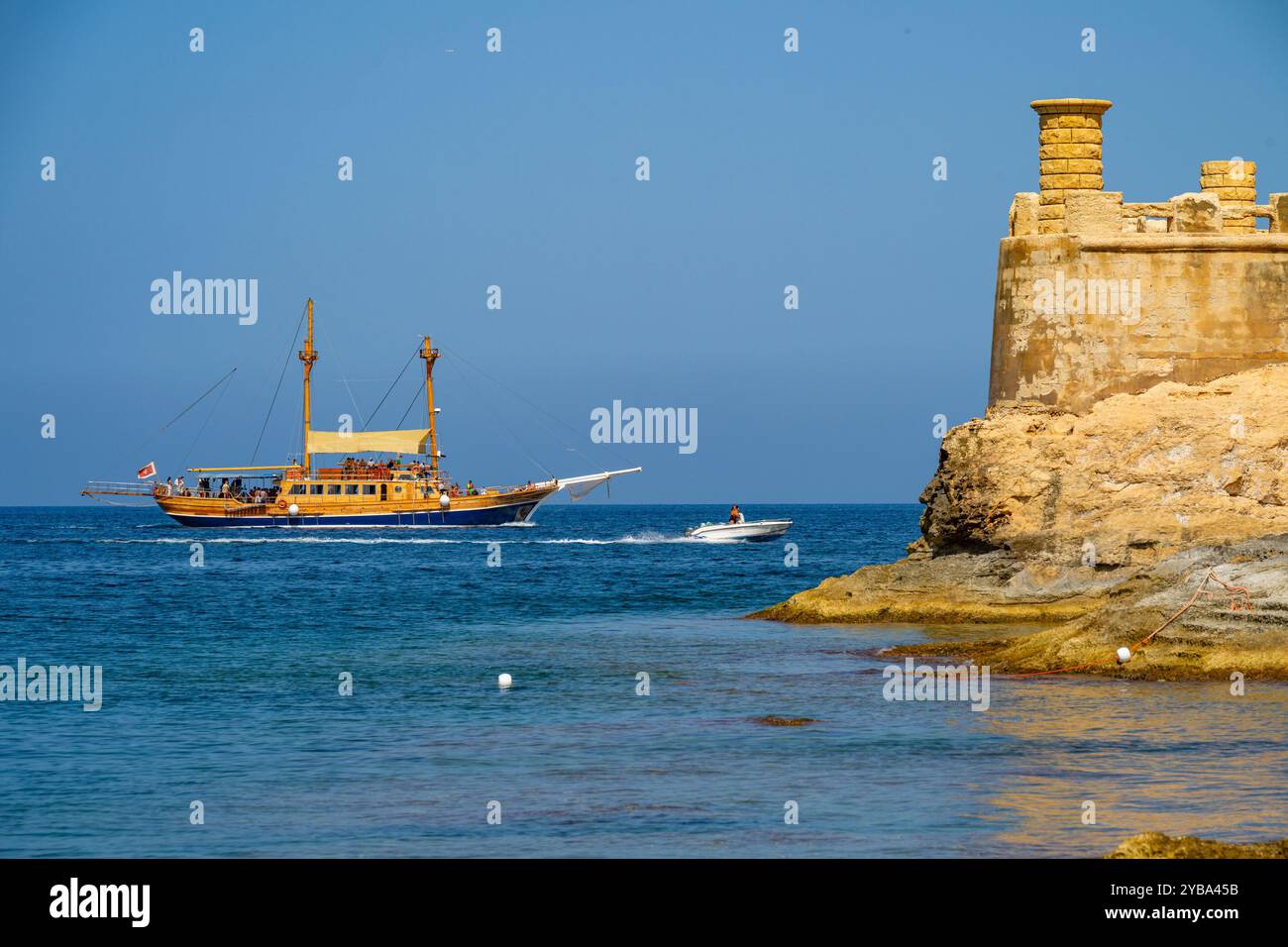 Day sail boat cruising past a fortification in Malta Stock Photo - Alamy