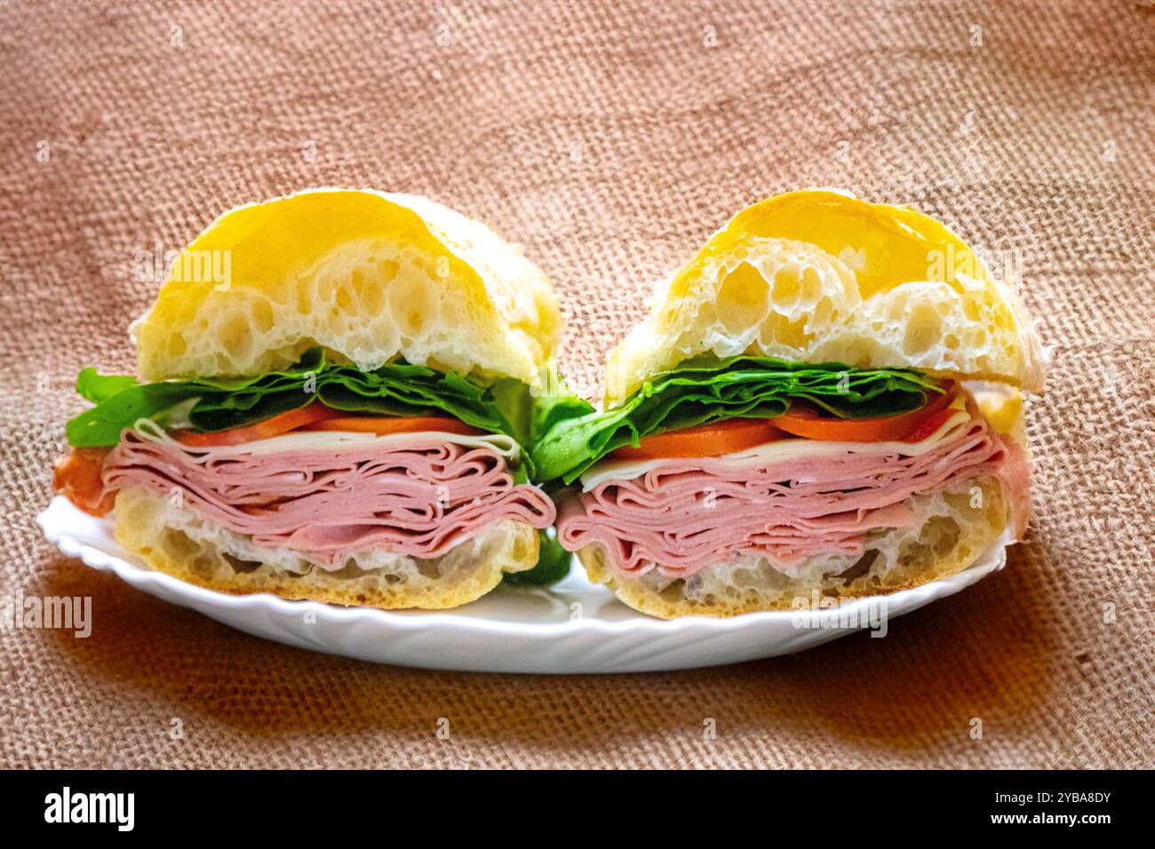 Italian mortadella bologna sandwich with arugula, tomato and cheese on ...