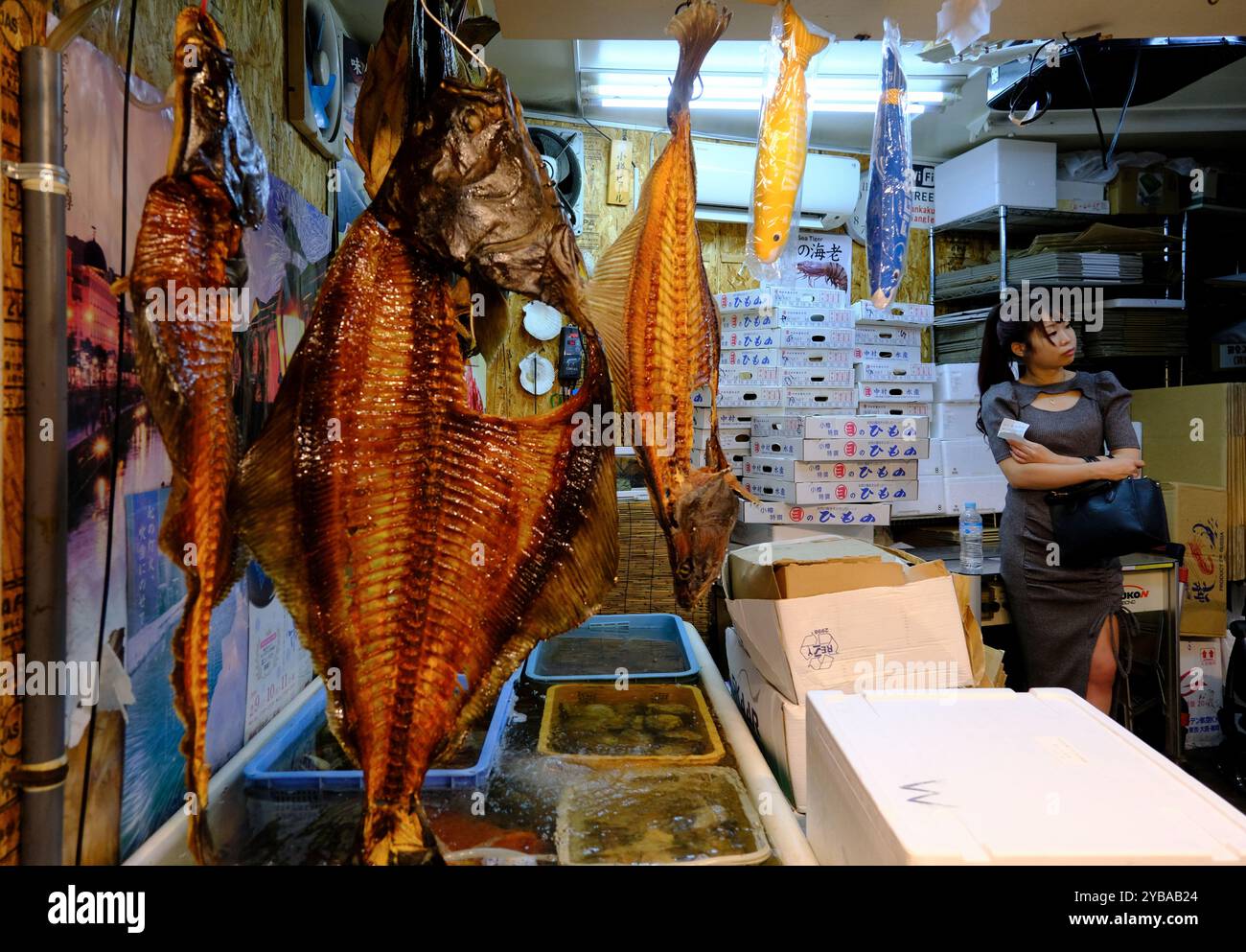 Dried fishes hanging at a market stall inside of Sankaku Market aka ...