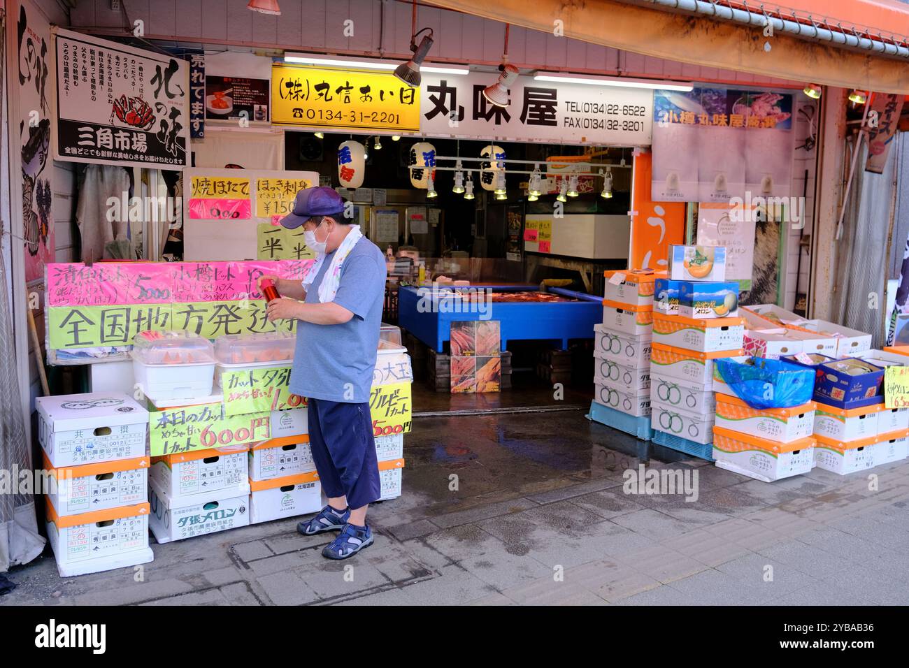 A seafood vendor at Sankaku Market aka Otaru Triangle Market.Otaru ...