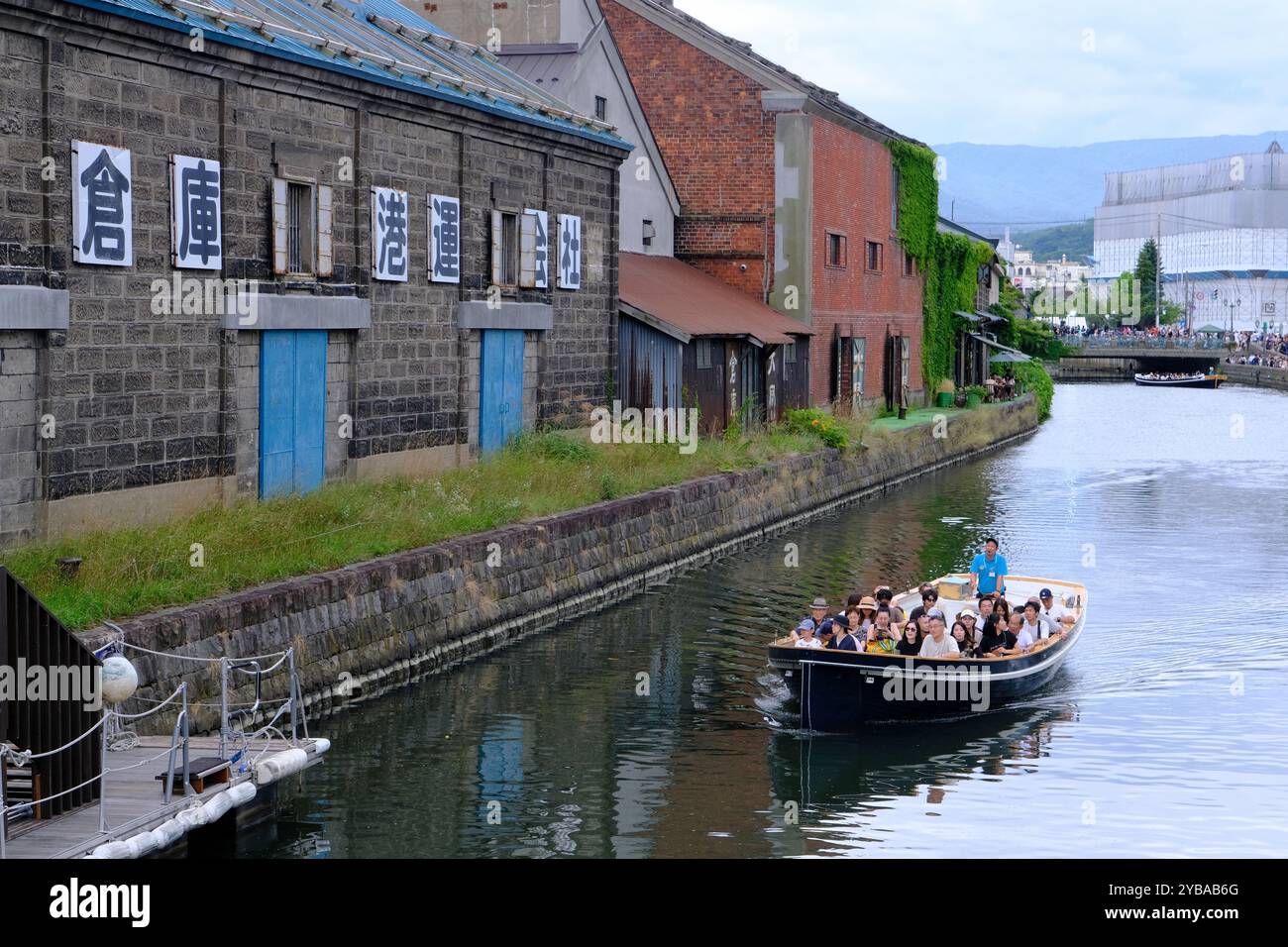 Tour boat in Otaru Canal with historic warehouses beside.Otaru.Hokkaido ...