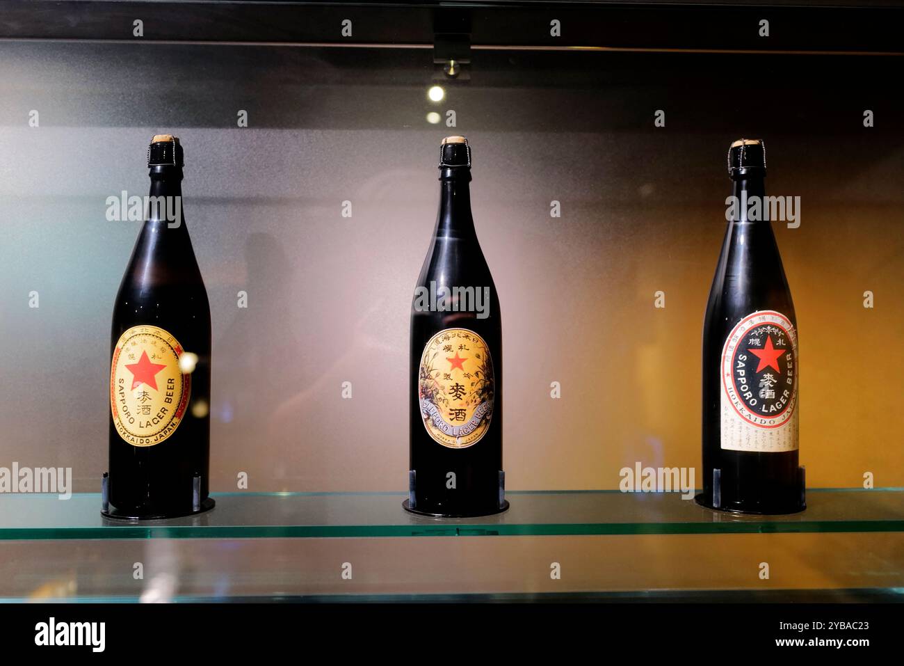 Beer bottles with different logos from different periods of time of ...