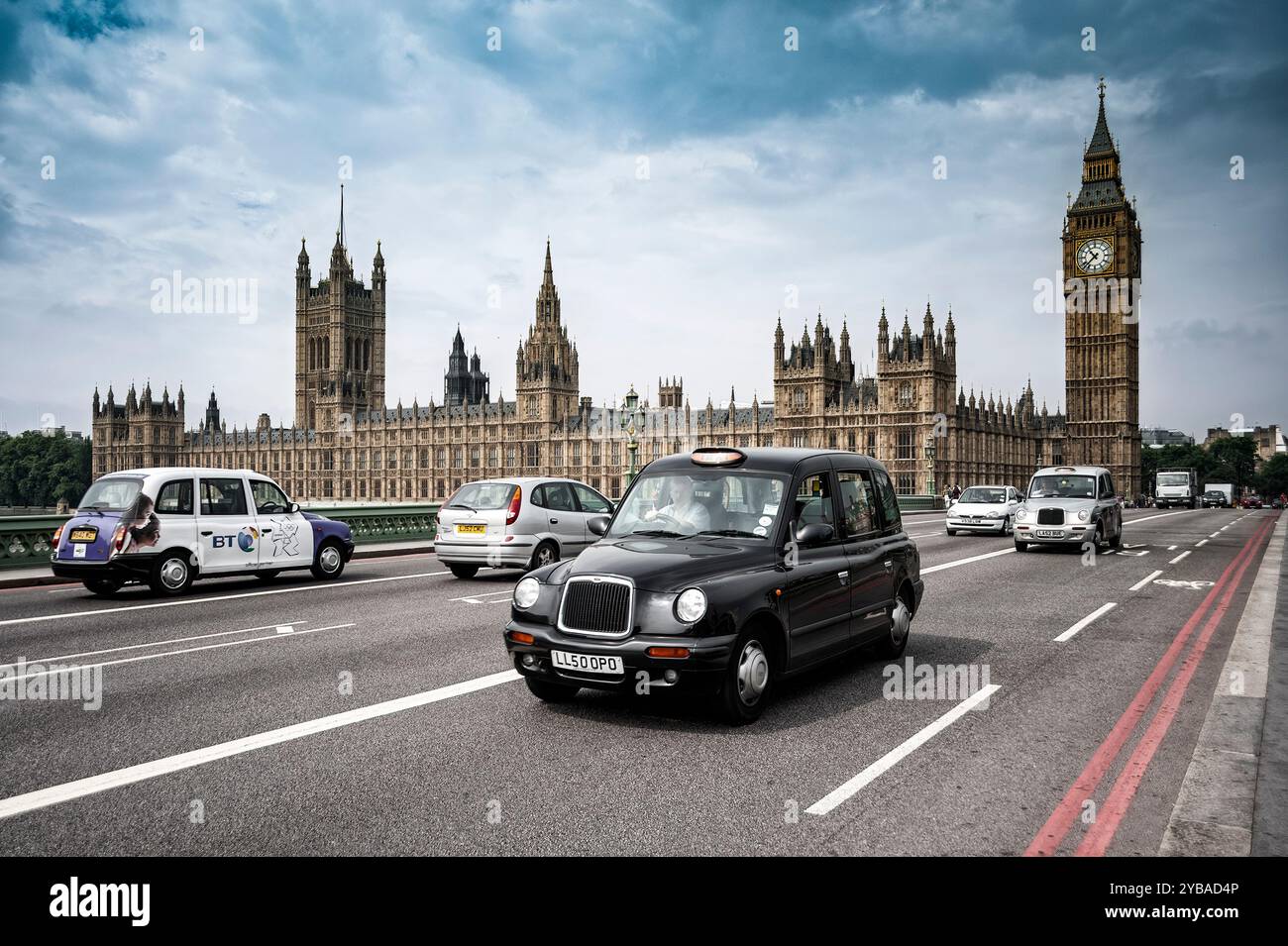 Traditional London Cabs on Westminster Bridge, London, showing the ...