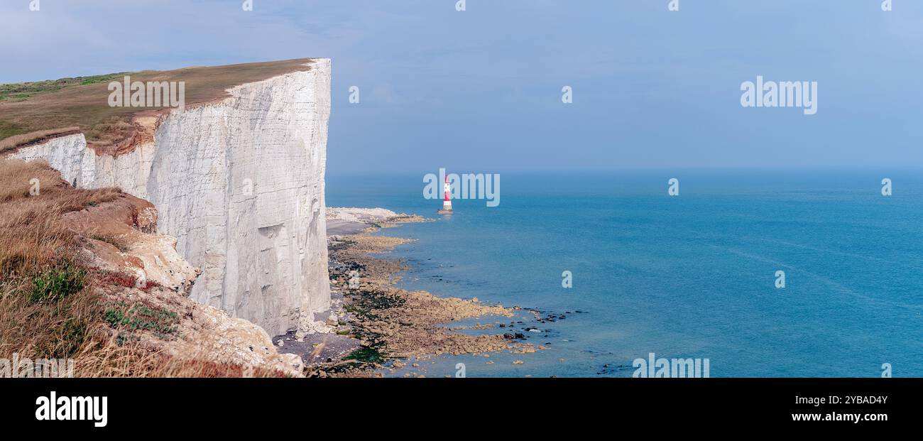 Panorama image of the white cliffs at Beachy Head with lighthouse on ...