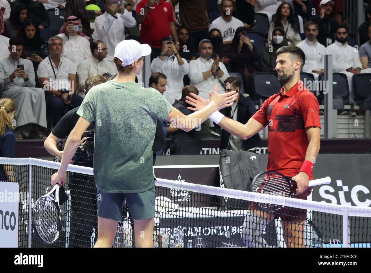 Riyadh, Saudi Arabia. 17th Oct, 2024. Novak Djokovic (R) of Serbia ...