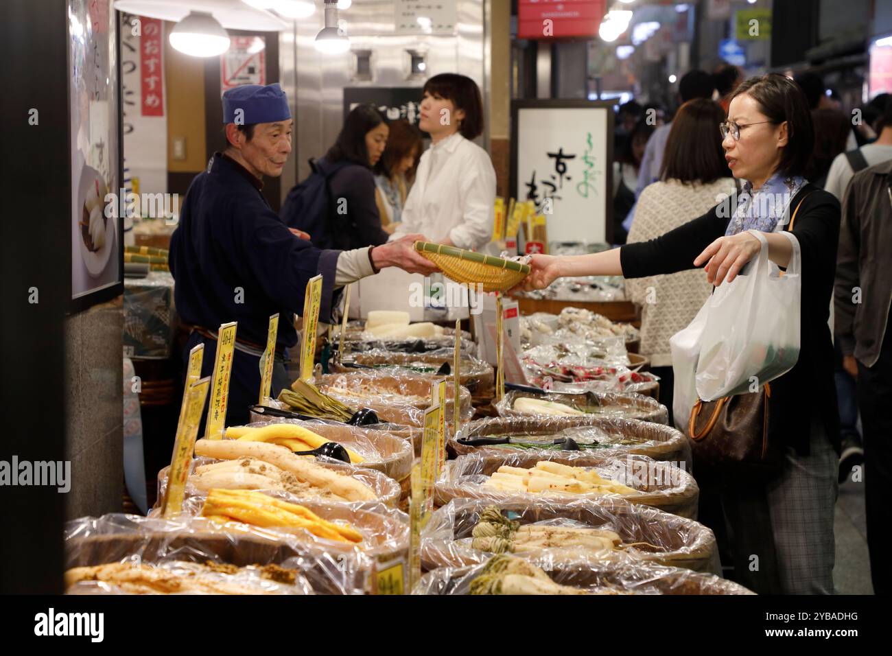 A customer buying traditional Japanese pickles from a pickle shop in ...