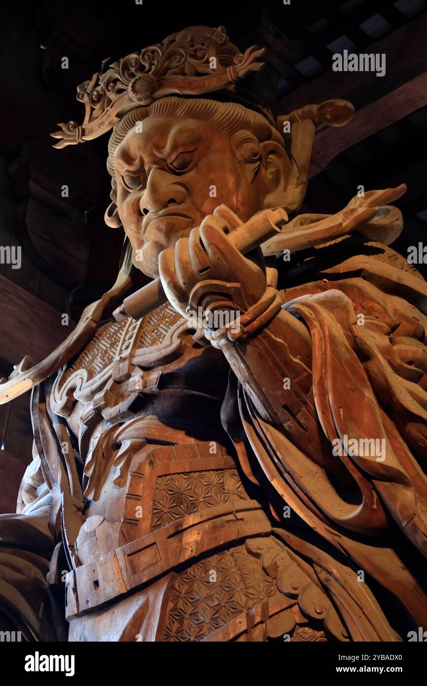 A closed up view of wooden statue of Komokuten in the Great Buddha Hall ...