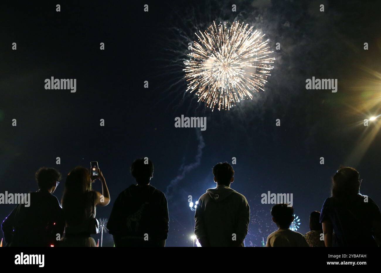 Yangon, Myanmar. 17th Oct, 2024. People watch a fireworks show during ...