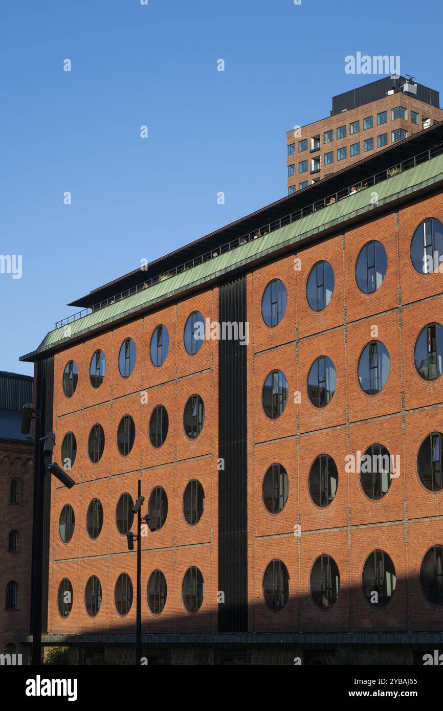 Modern brick facade with round windows, contemporary architecture ...