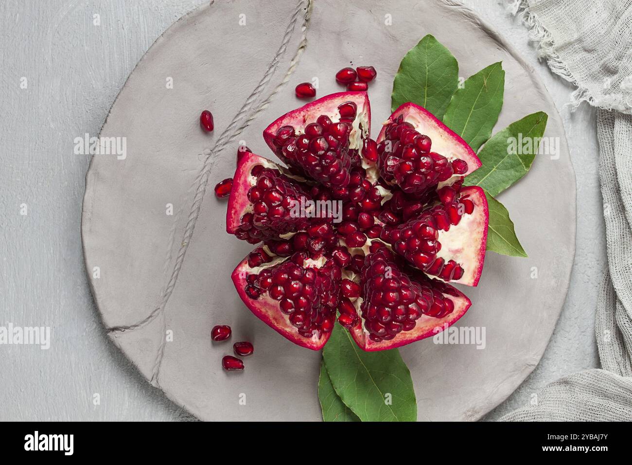 Fresh, cut pomegranate fruit, on a gray background, food concept, top ...