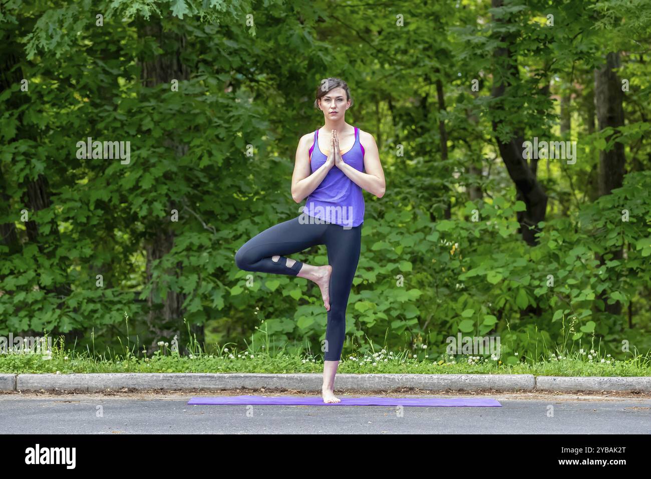 Amidst the campus bustle, a serene brunette college student finds ...