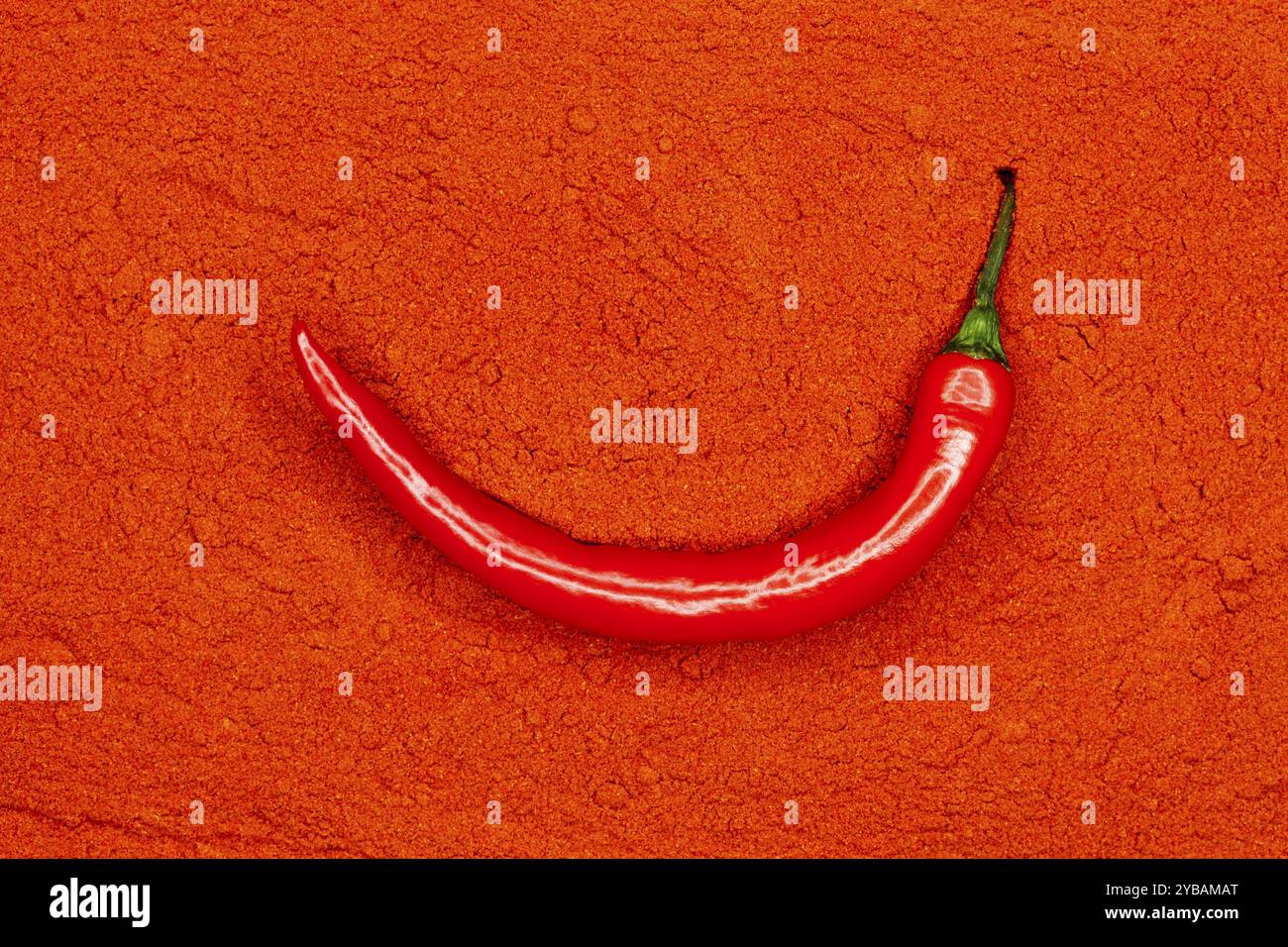 Fresh red chilli peppers on paprika powder Stock Photo - Alamy