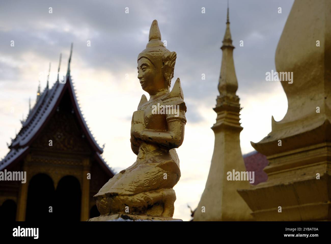 An golden statue of Buddha and the architectures of Wat Sen souk Haram ...