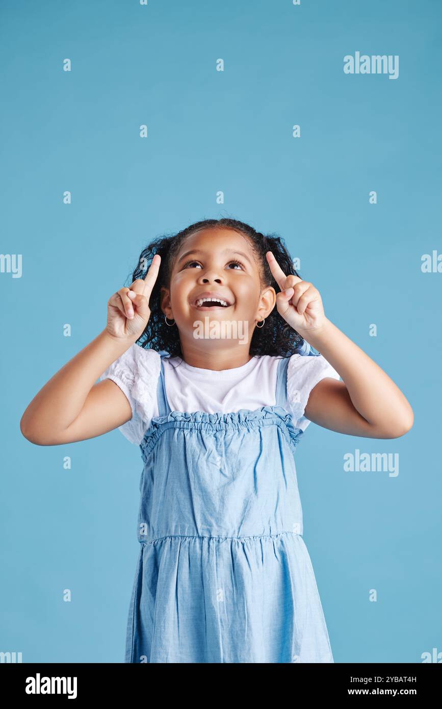 Studio, child and pointing with hands for marketing, product placement ...