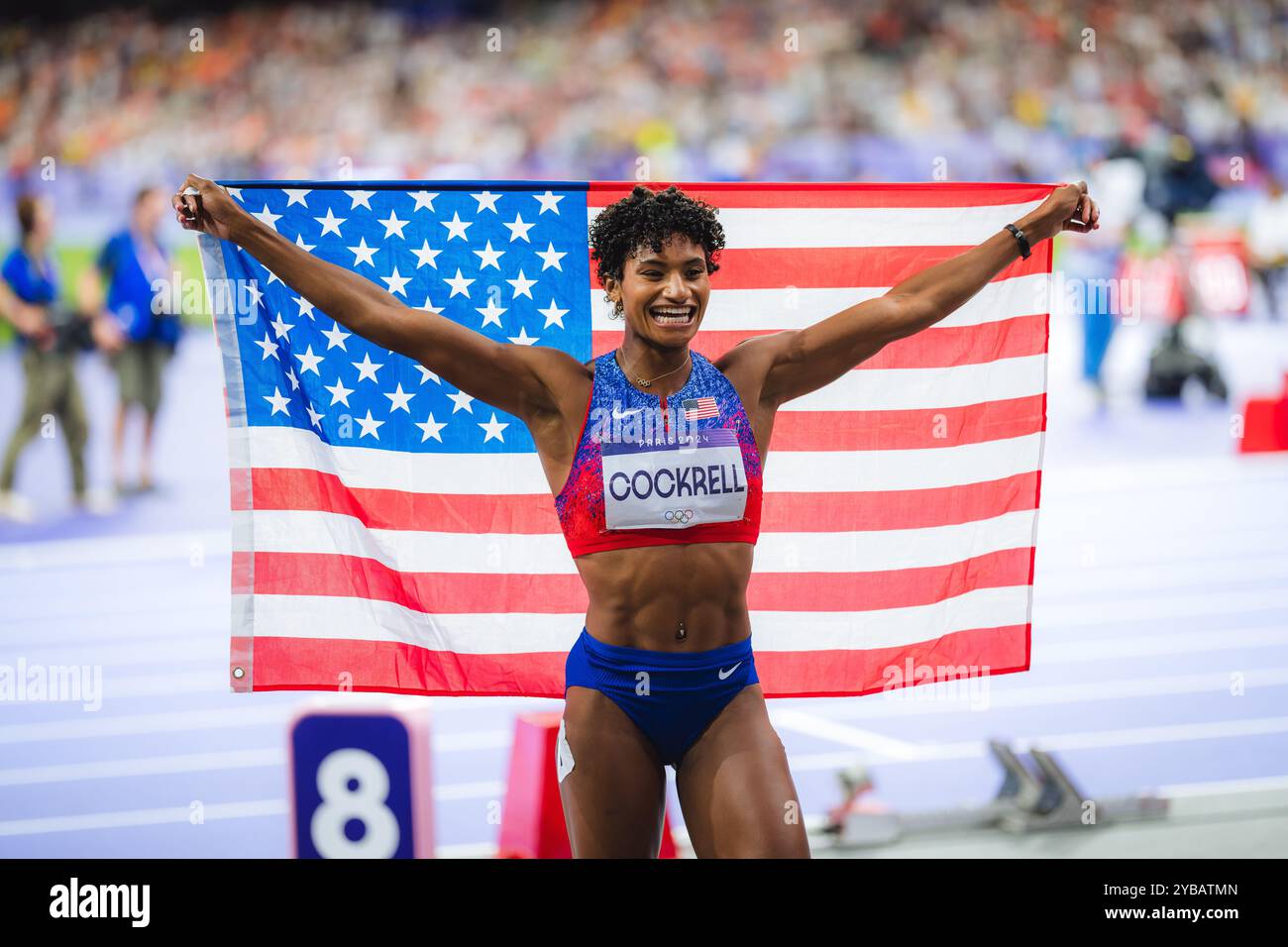 Anna Cockrell celebrating with her country's flag in the 400 meters ...