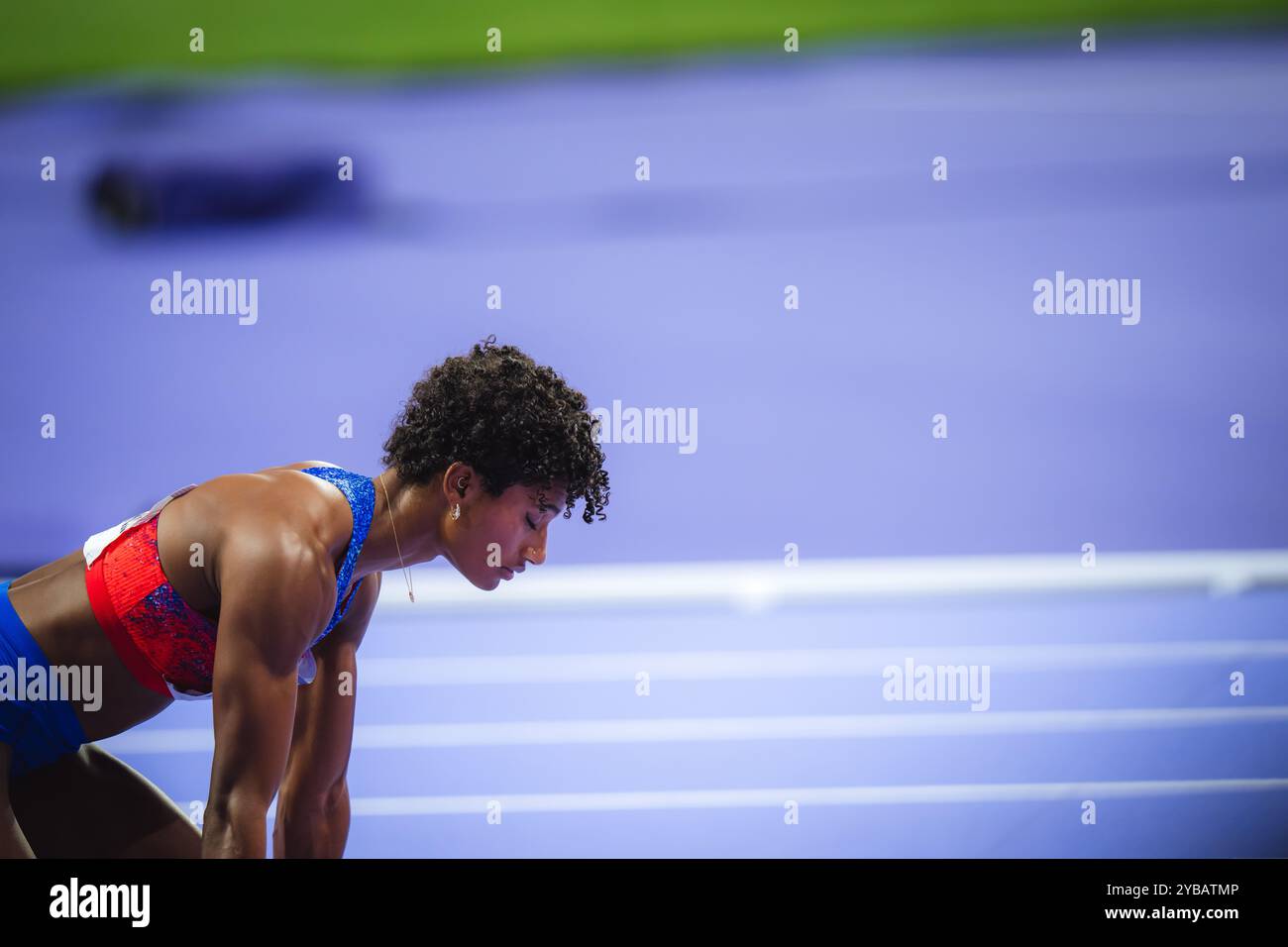 Anna Cockrell participating in the 400 meters hurdles at the Paris 2024 ...