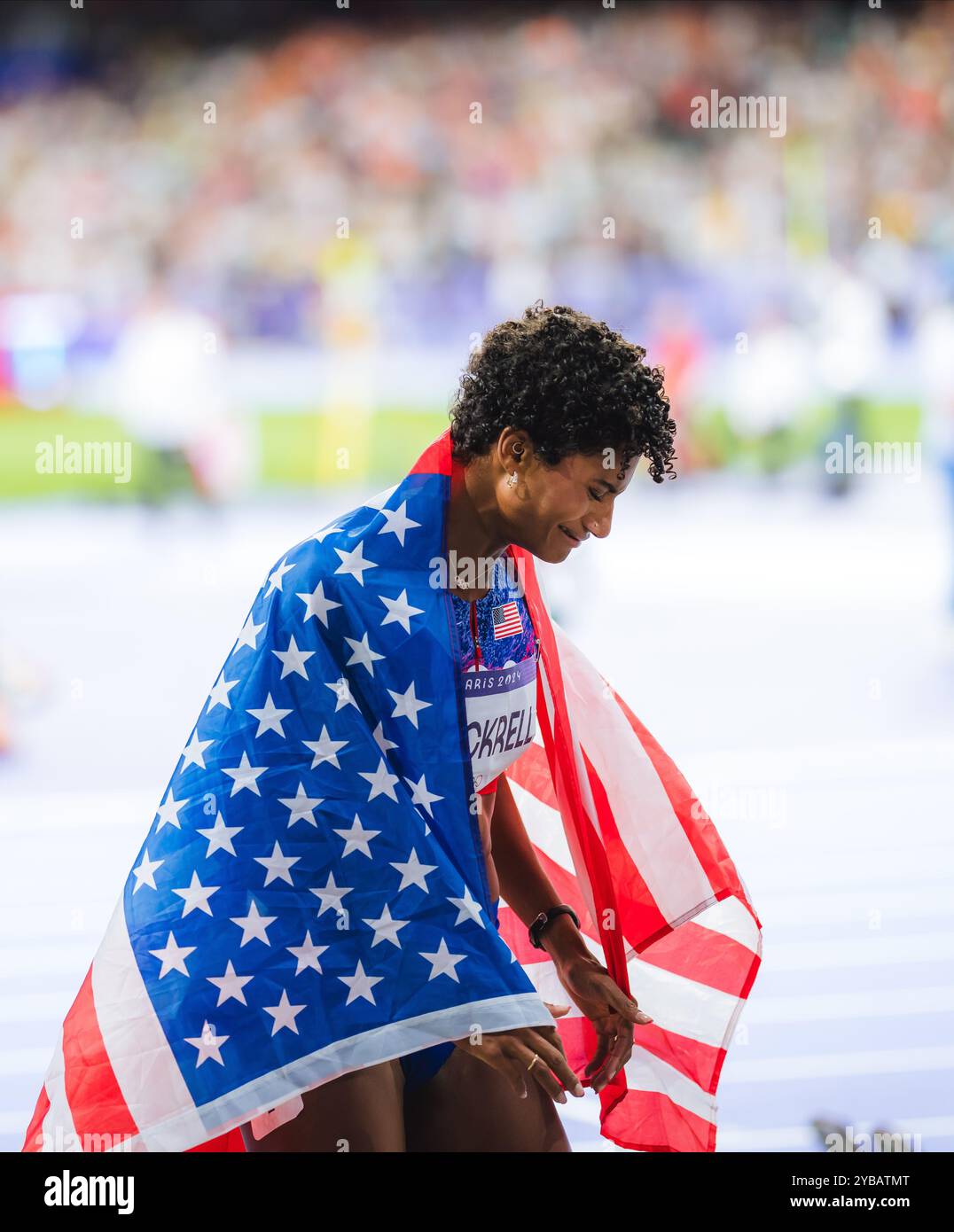 Anna Cockrell celebrating with her country's flag in the 400 meters ...