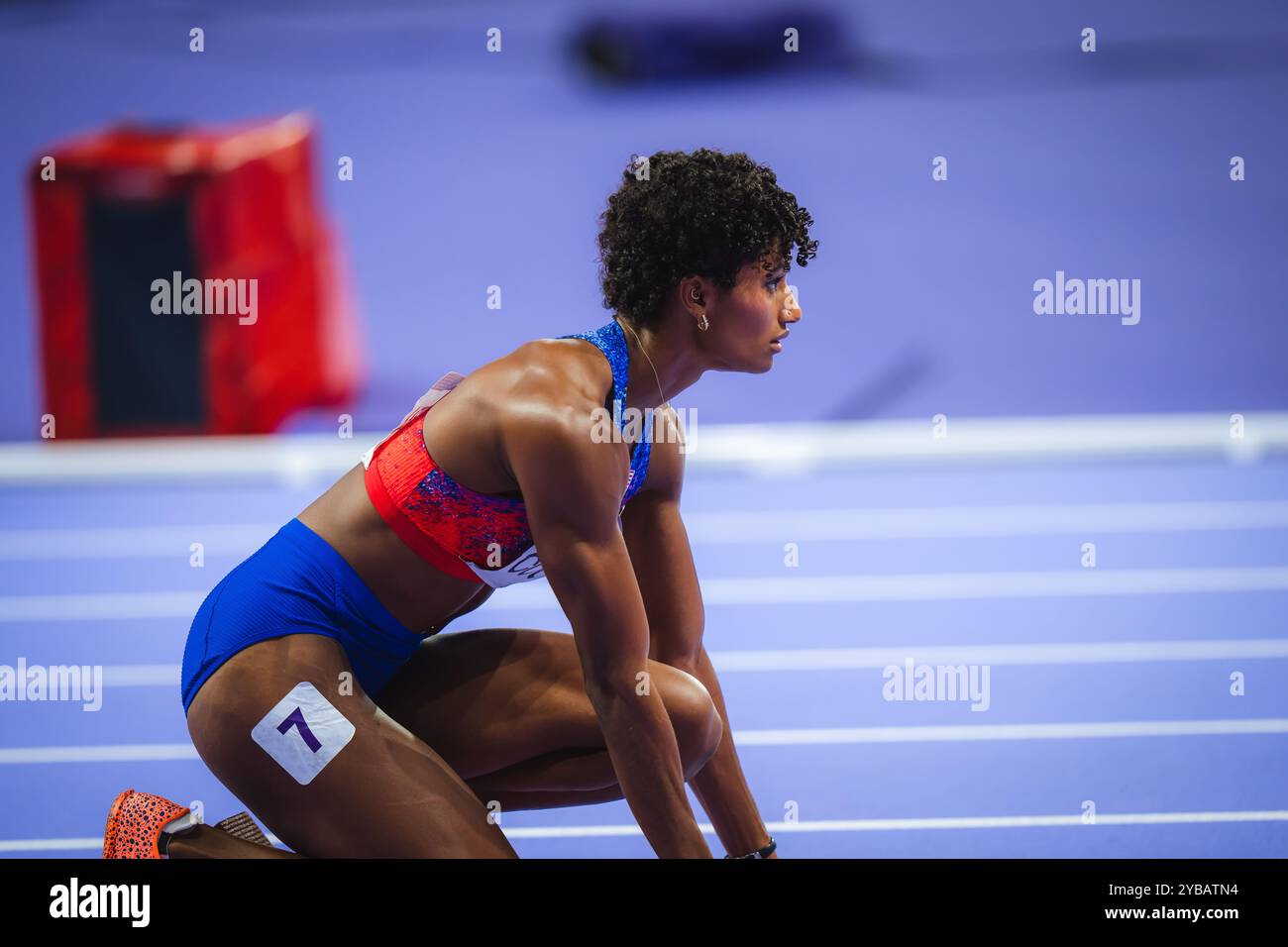 Anna Cockrell participating in the 400 meters hurdles at the Paris 2024 ...