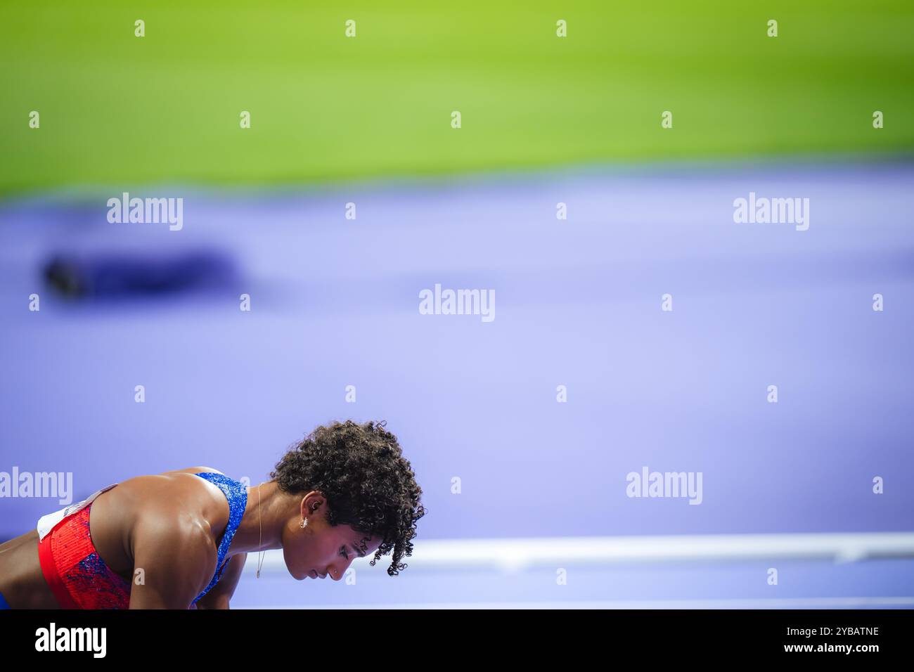 Anna Cockrell participating in the 400 meters hurdles at the Paris 2024 ...