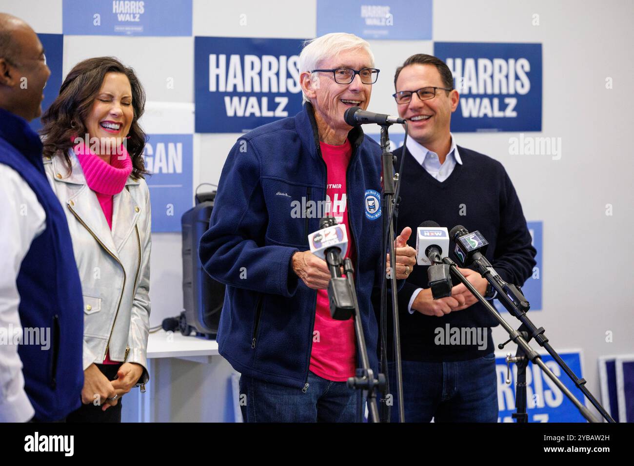 Flint, Michigan, USA. 17th Oct, 2024. Wisconsin Gov. TONY EVERS, center ...
