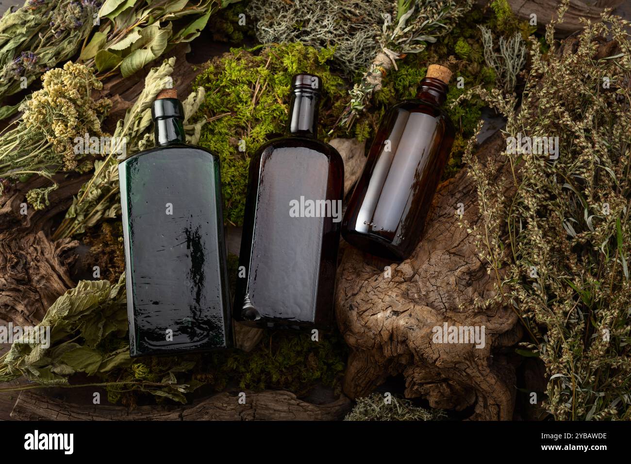 Vintage bottles with tinctures and various dried herbs. Concept of ...