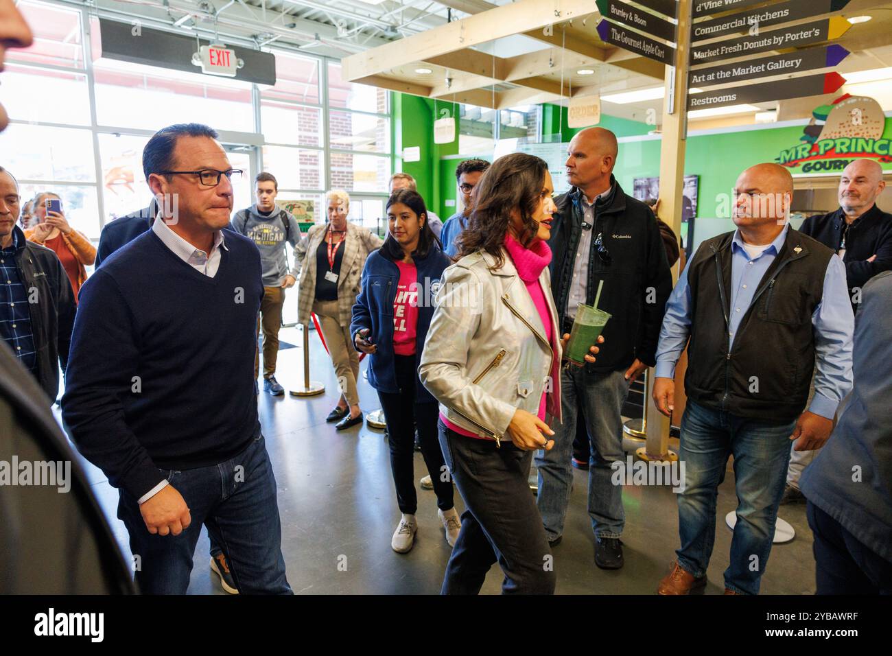 Flint, USA. 17th Oct, 2024. Pennsylvania Gov. Josh Shapiro, left, and ...