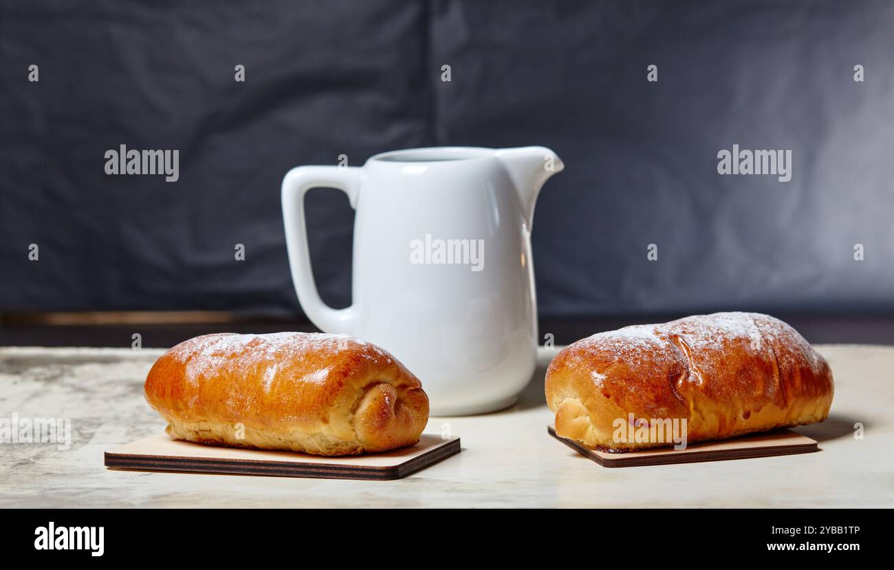Homemade buns with jam with powdered sugar on wooden background. Fresh ...