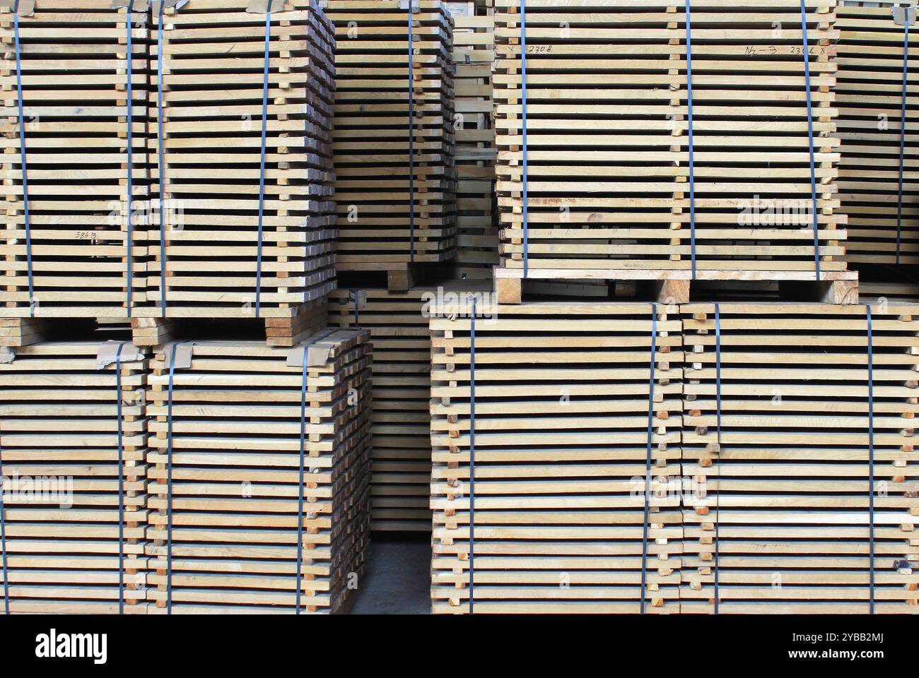 Edged board on pallets standing on each other. Background Stock Photo ...