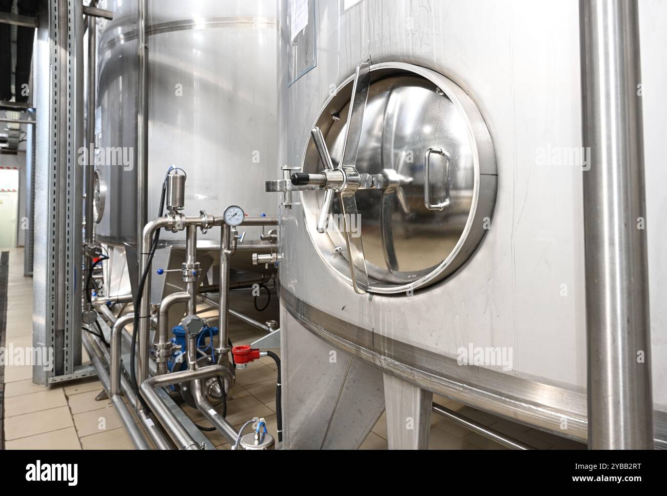 Steel tanks for mixing liquid. Food industry Stock Photo - Alamy