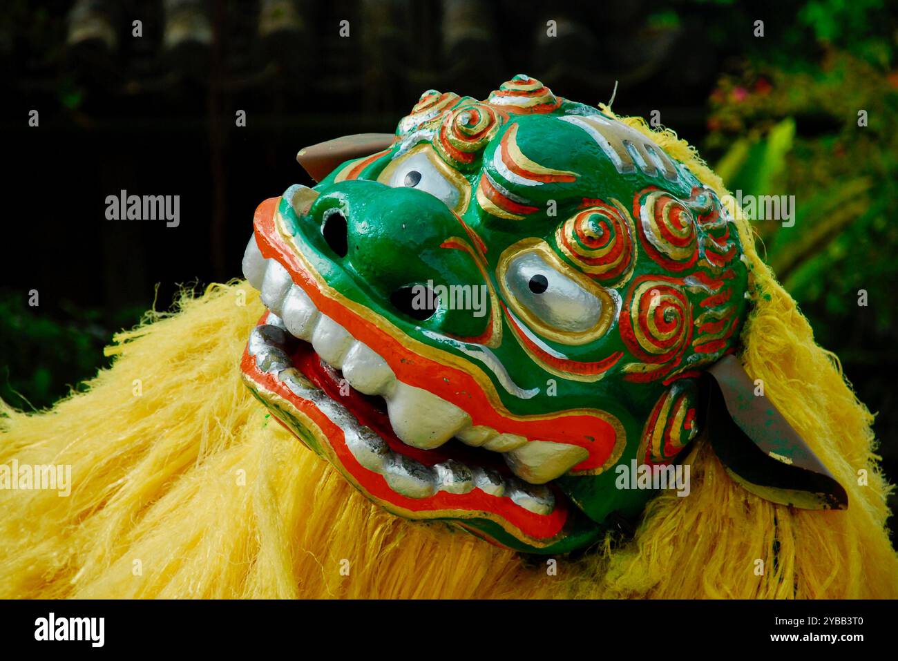 A vibrantly painted "Shisa Dog" mask and costume worn during a ...