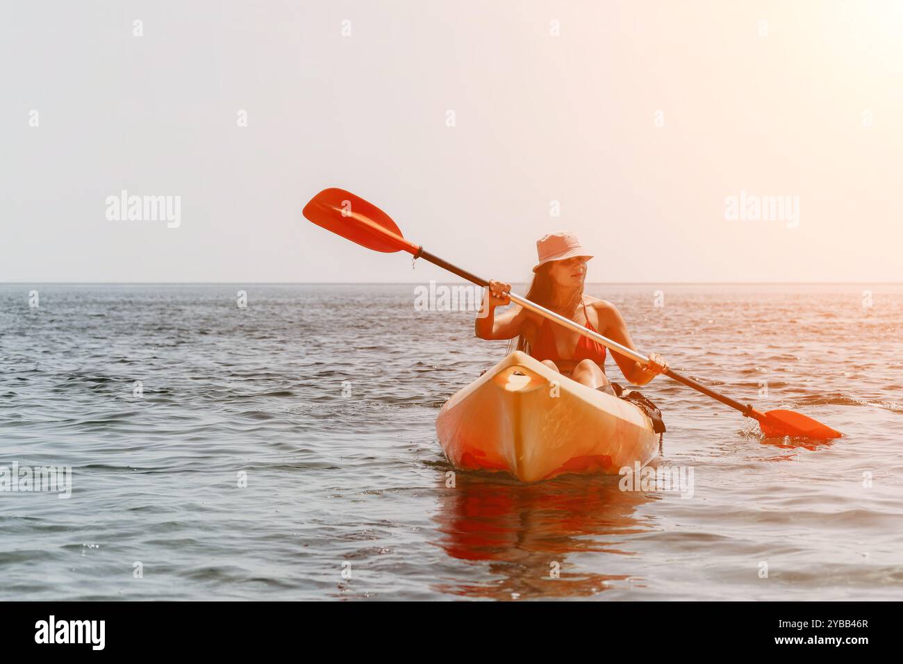 Kayaking Woman Ocean Sunset - Happy woman kayaking in ocean during ...