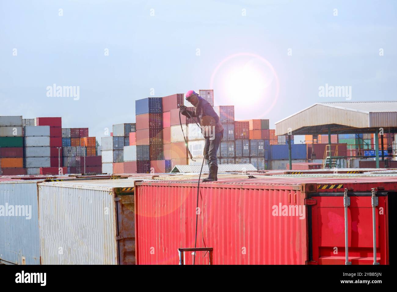 Industrial welder in Container storage yard Stock Photo - Alamy