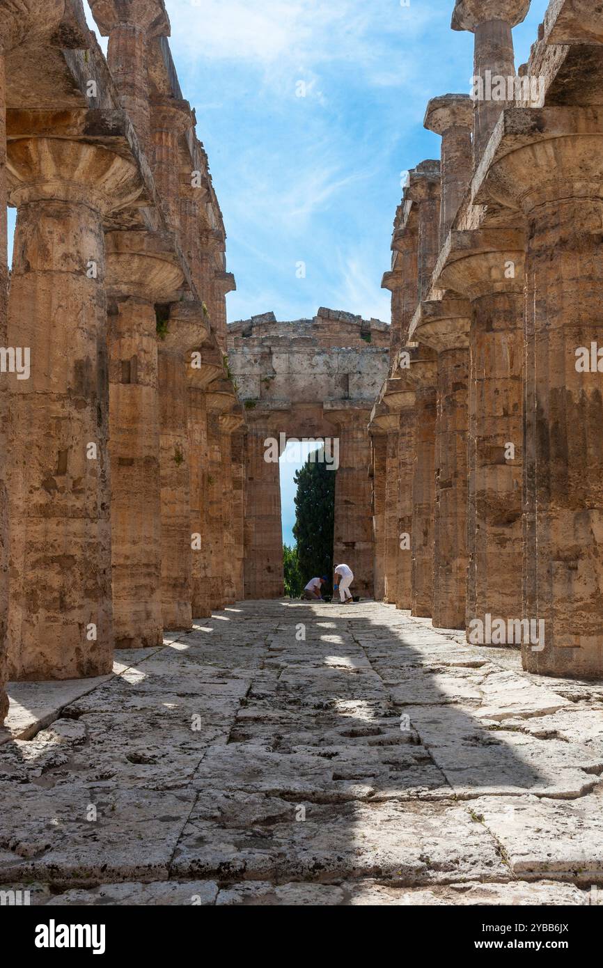 Two archaeologists working in the cella or inner sanctuary of the ...