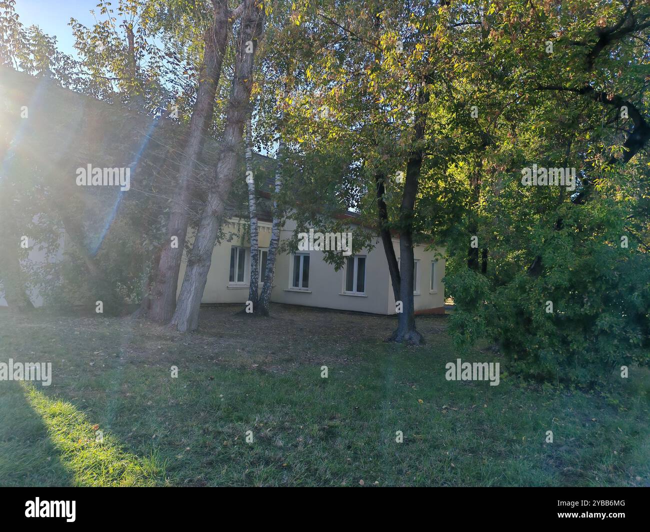 sturdy building with red brick columns and a sloping roof, set against ...