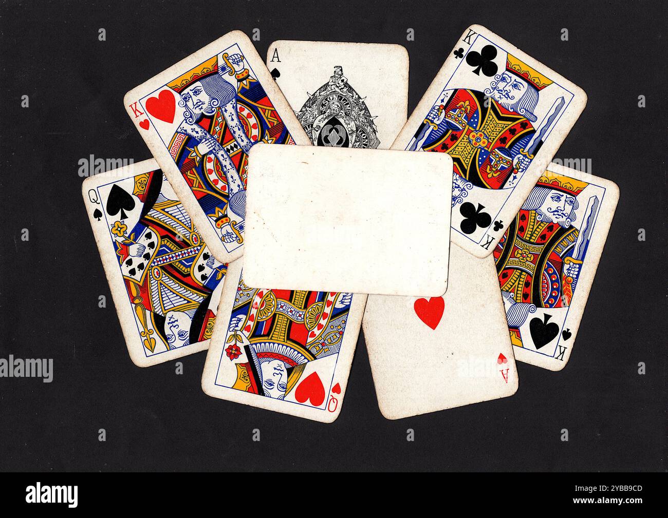 A montage of vintage playing cards with a blank card in the middle on a ...