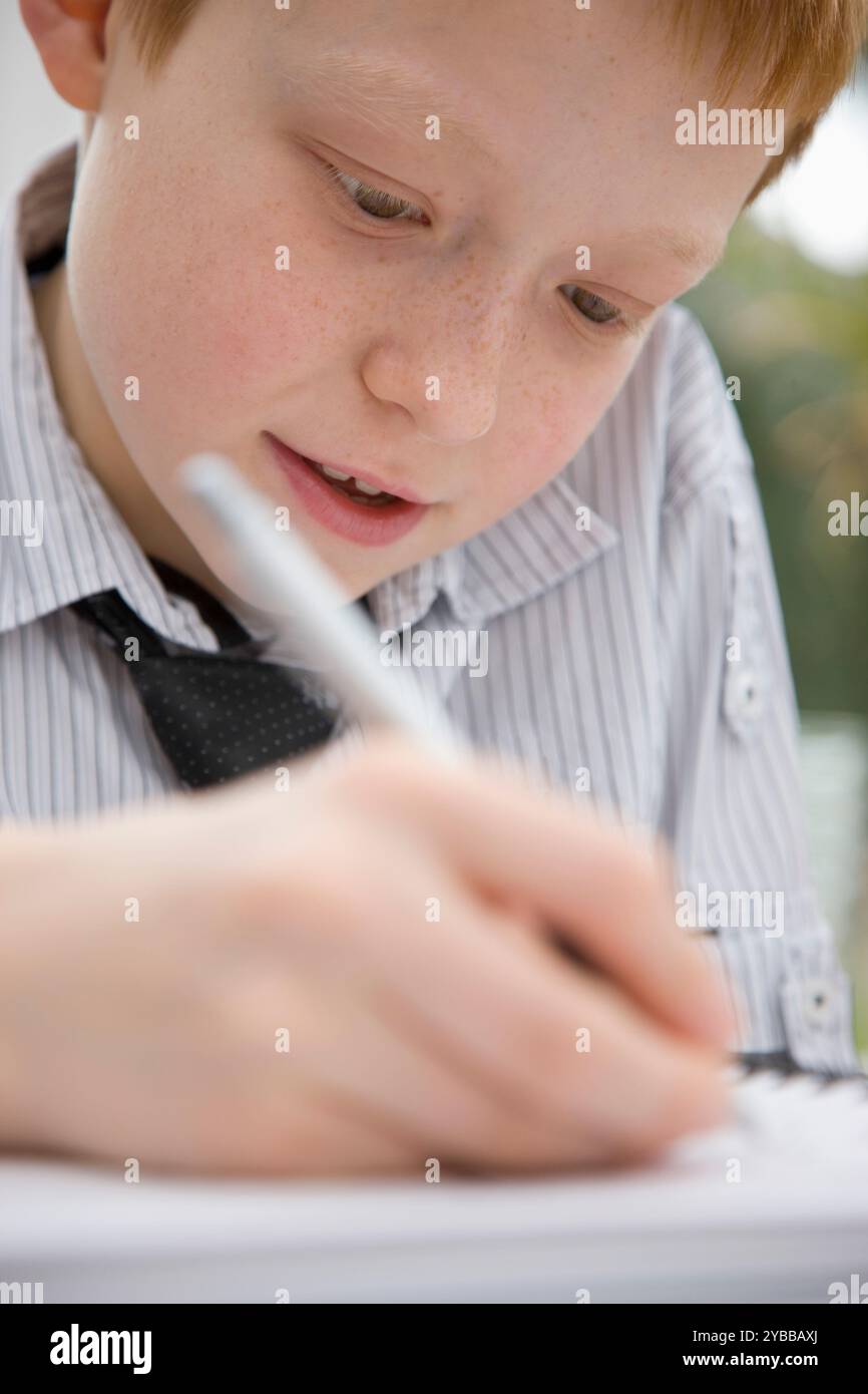 Boy doing homework Stock Photo - Alamy