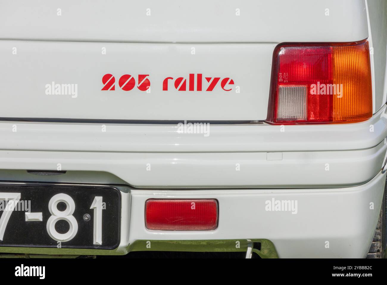 Detail showing the red 205 rallye logo on a white peugeot 205 rallye ...