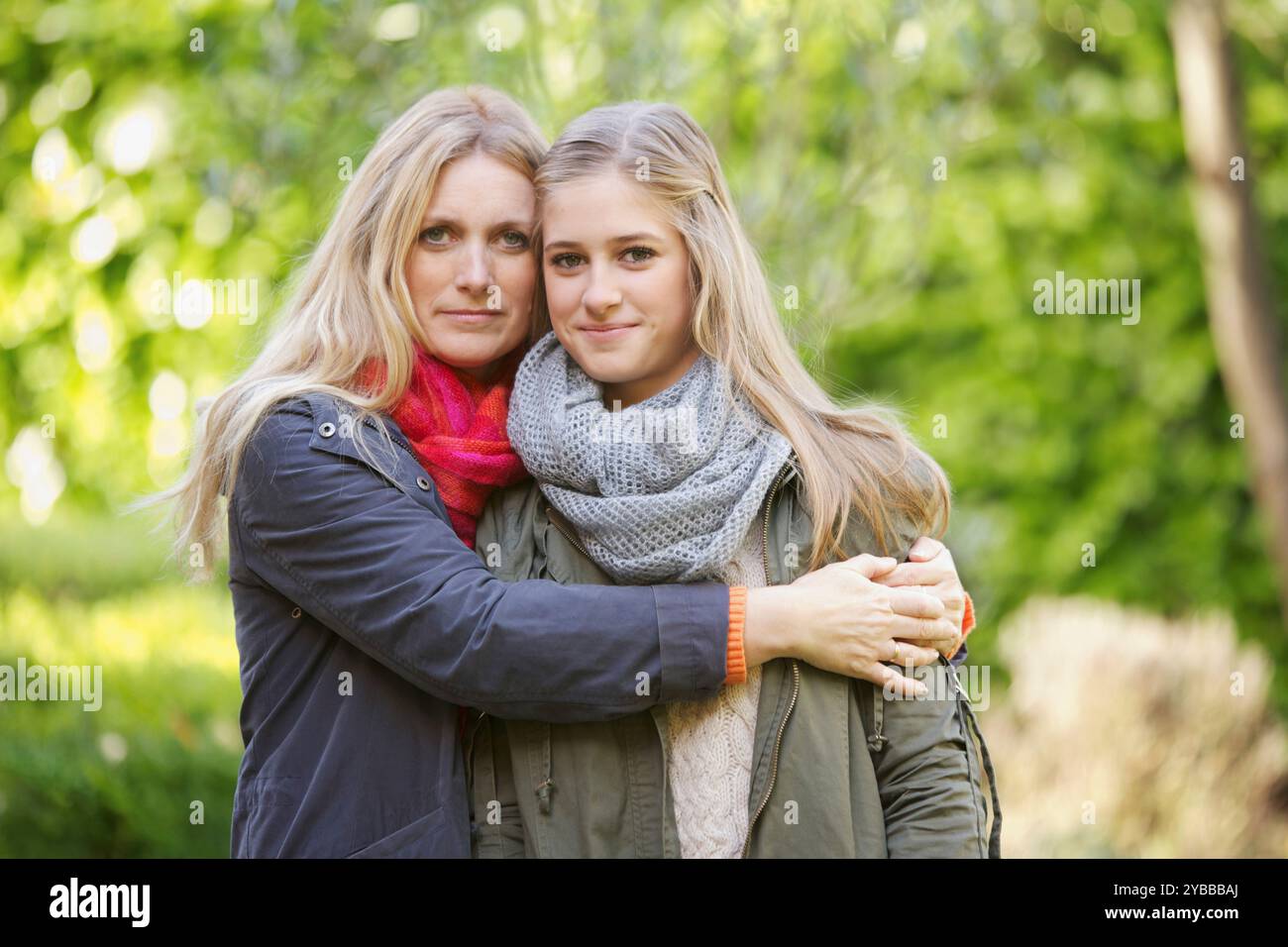 Mother Hugging Daughter Outdoors Stock Photo - Alamy