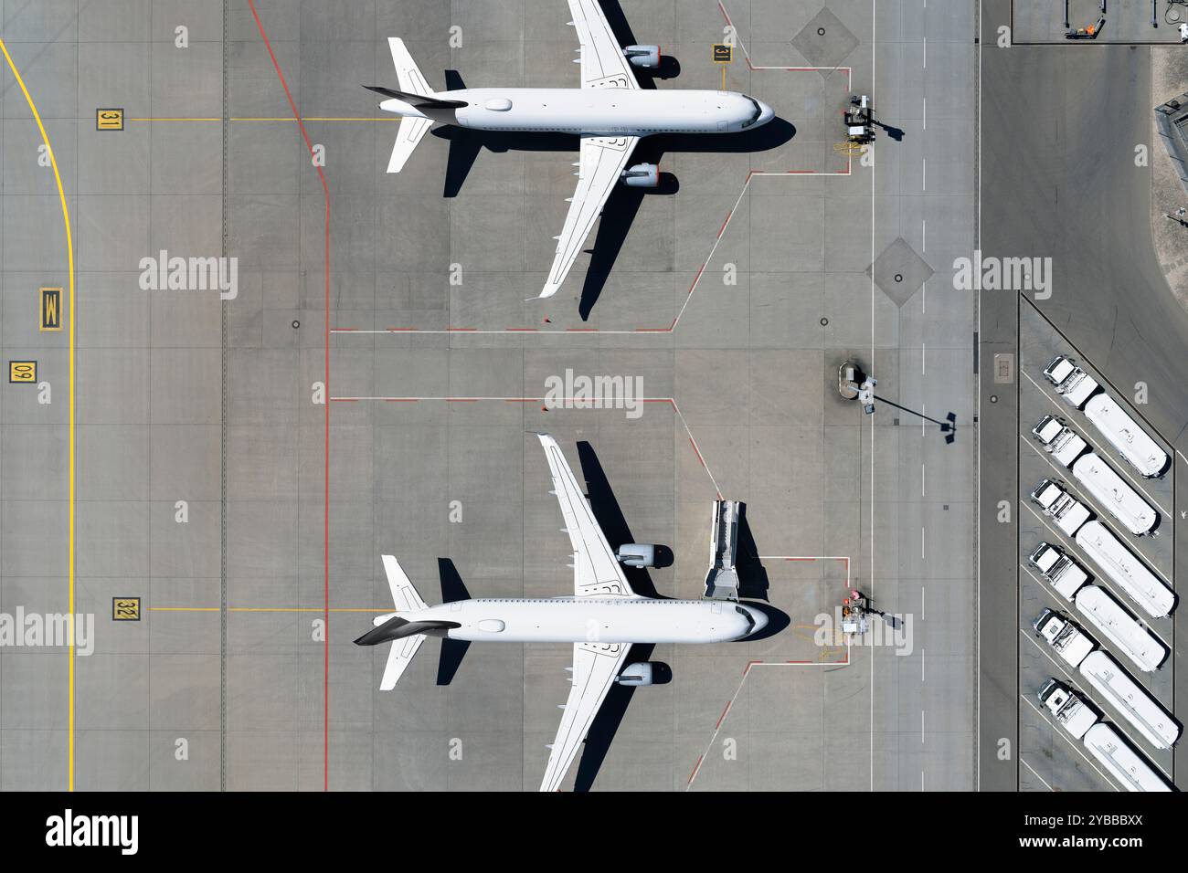 View from above airplanes parked on sunny airport tarmac Stock Photo ...