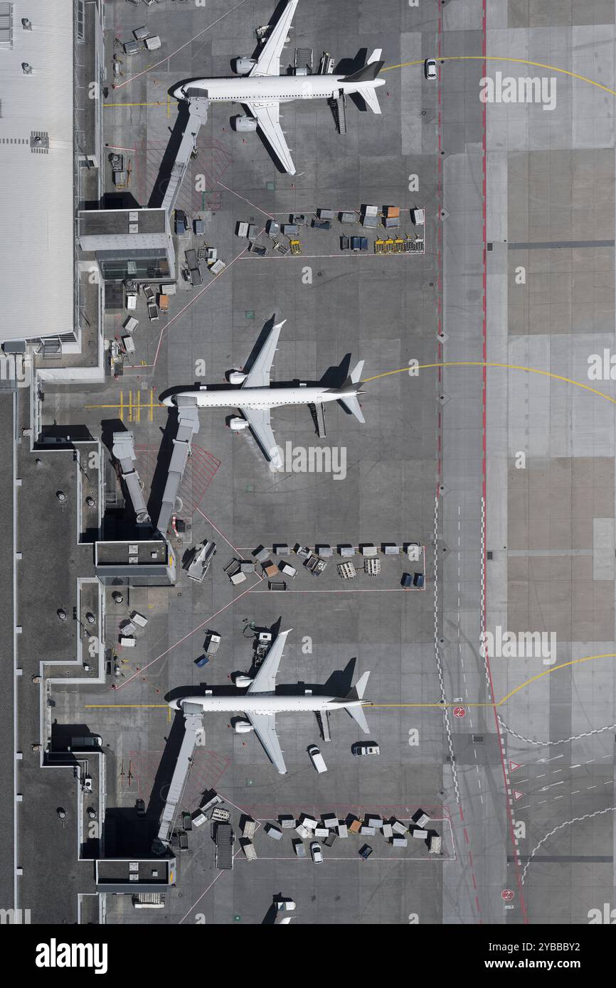 View from above airplanes parked on sunny airport tarmac Stock Photo ...