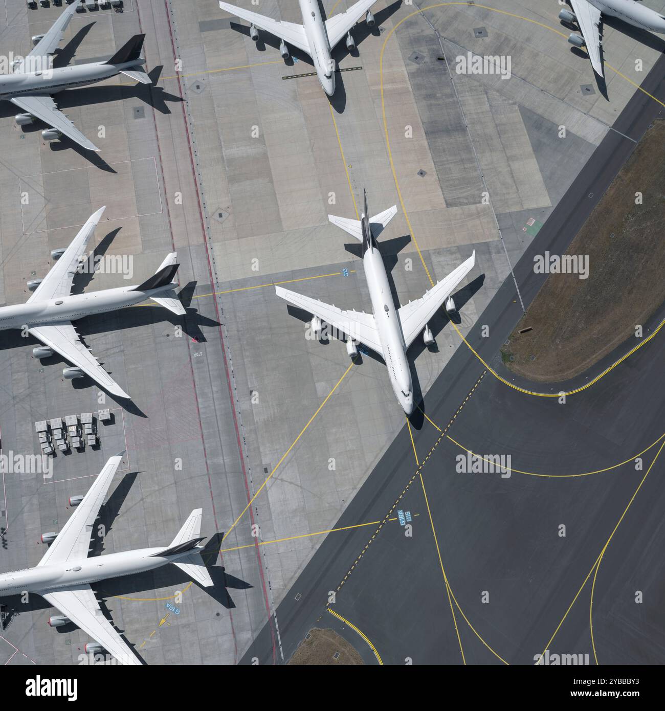 View from above airplanes on sunny airport tarmac and runway Stock ...