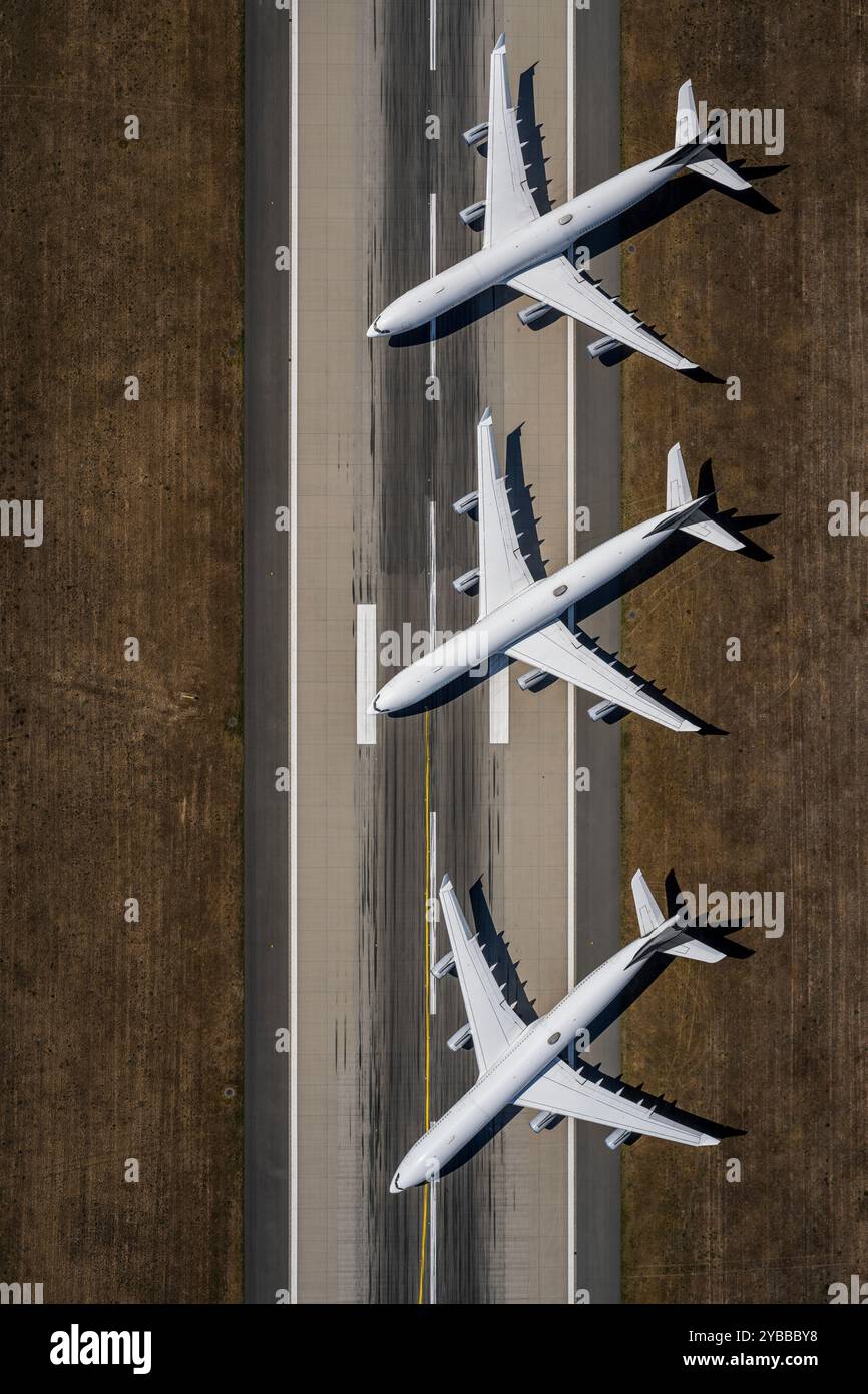 View from above airplanes parked on sunny airport runway Stock Photo ...