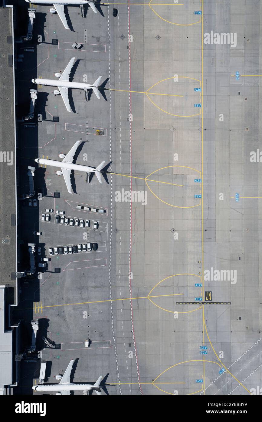 View from above airplanes parked at airport departure gates on tarmac ...