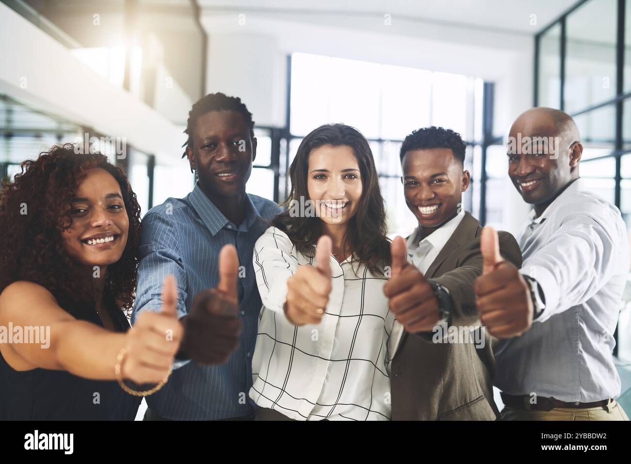 Thumbs up, teamwork and portrait of business people in office with hand ...