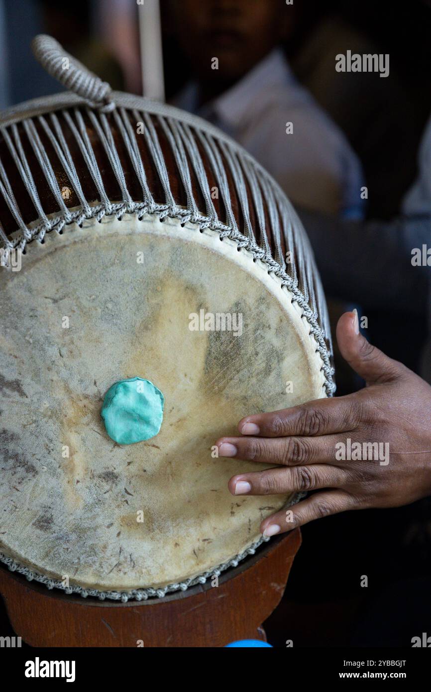 Playing Cambodian traditional percussion at Wat Phnom, Phnom Penh ...