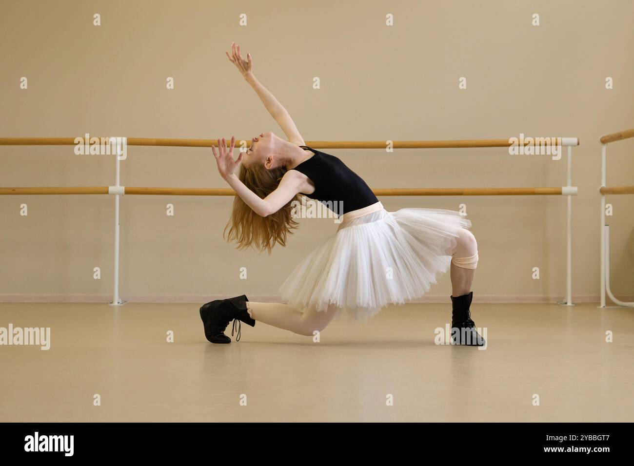 Ballerina in shoes and tutu, bending backward in expressive modern ...